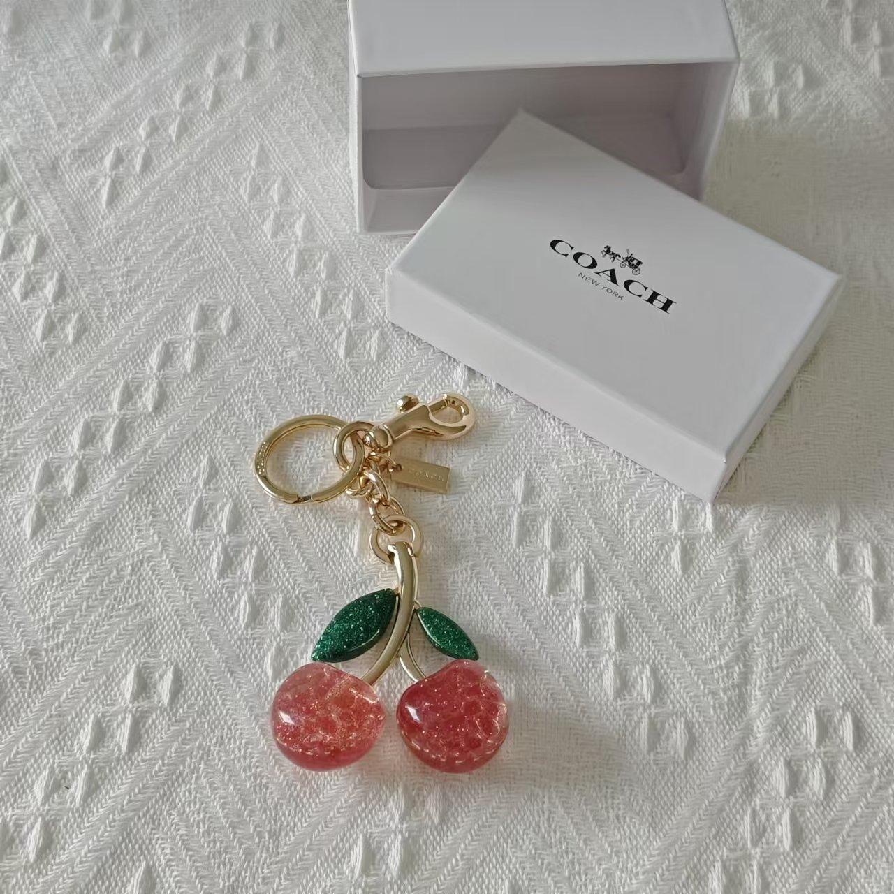 Coach Beautiful cherry keychain, flawless! - Depop