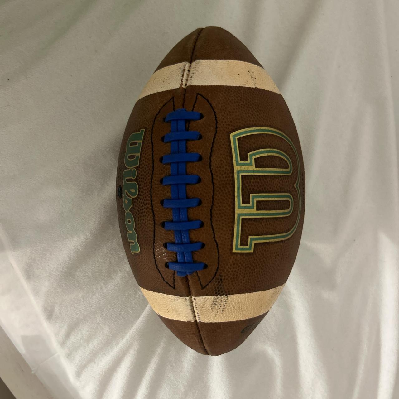 Brown, blue, and green Wilson football #football | Depop