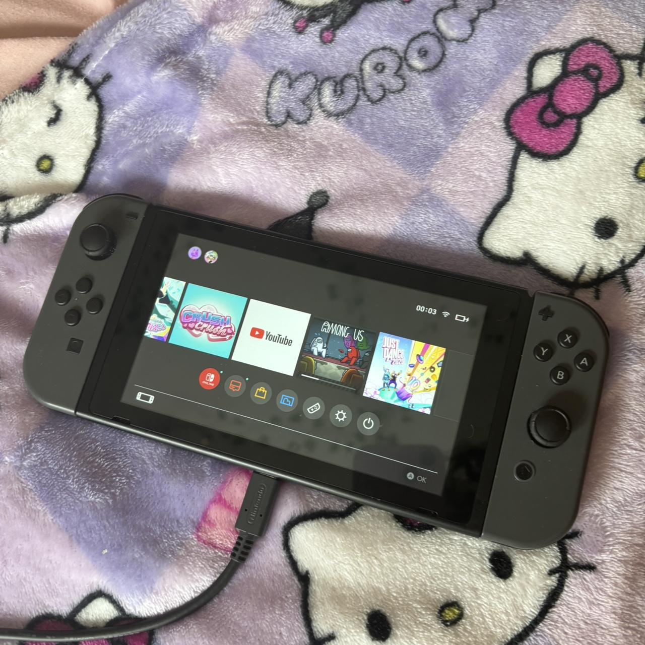 Nintendo Switch in black has games such as Mario... - Depop