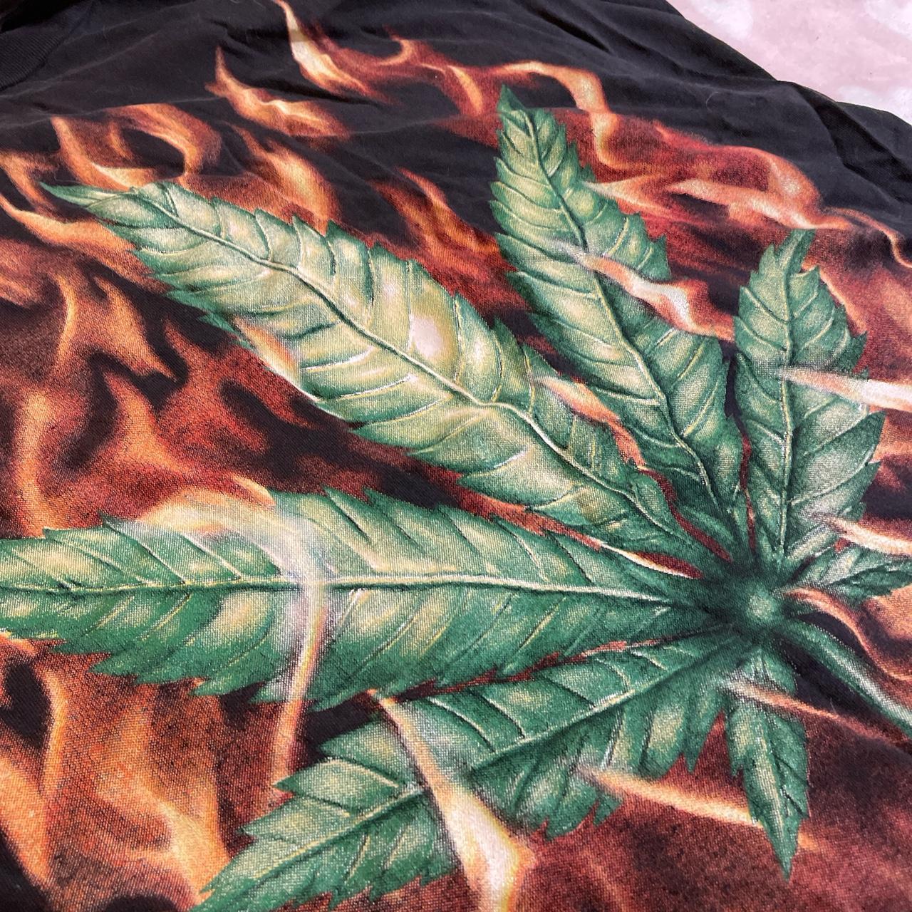 flaming burning pot marijuana leaf color in the... - Depop