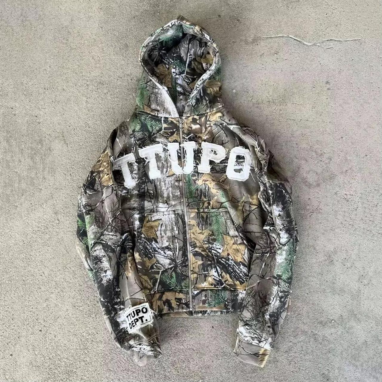 Camo zip-up hoodie with TTUPO print have all three... | Depop