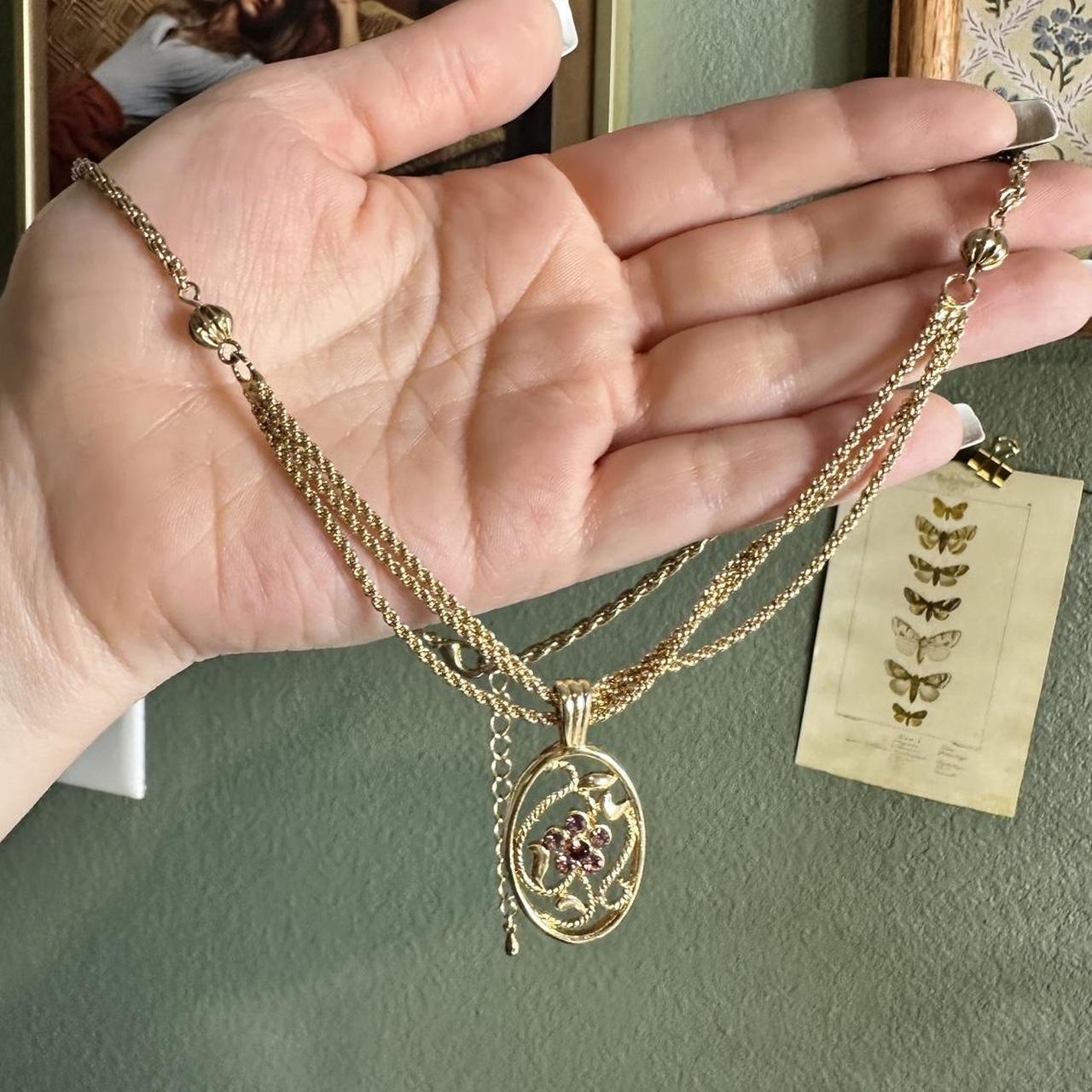 Beautiful gold toned necklace with purple flower... - Depop