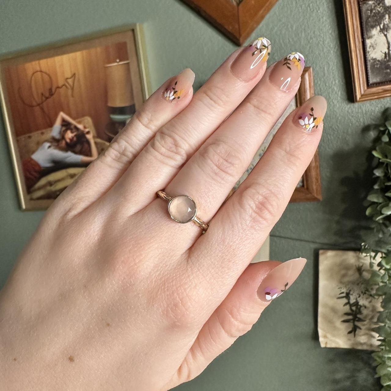Gold toned ring with pale pinky/beige stone. Size 10 - Depop