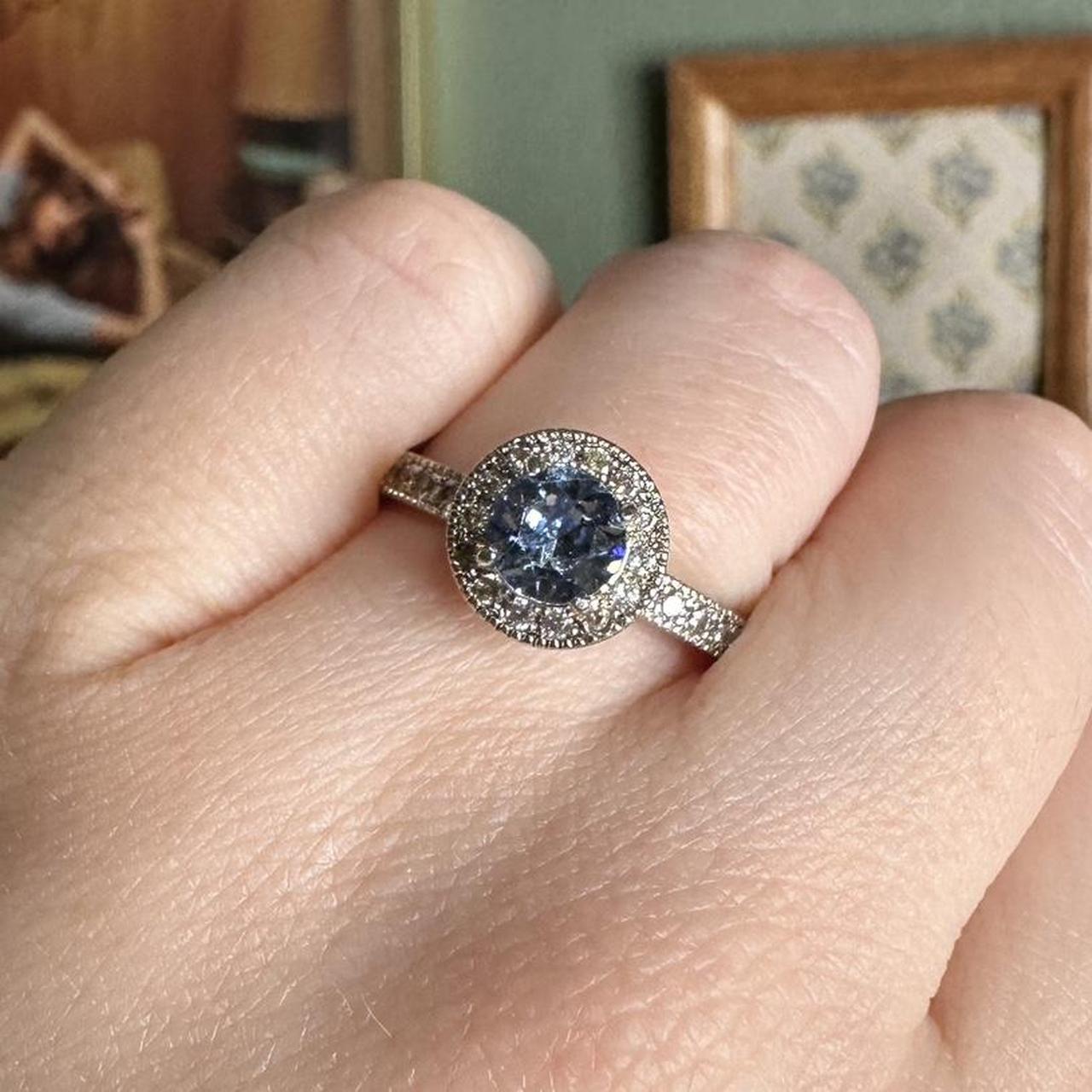 Silver toned ring with blue stone in center of tiny... - Depop