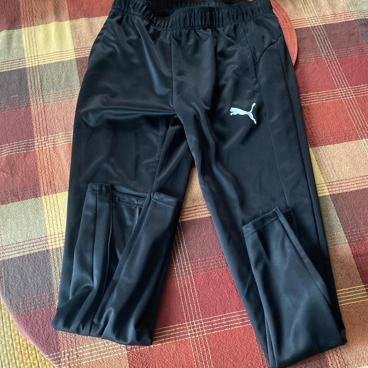 Black Puma joggers with a relaxed fit... - Depop