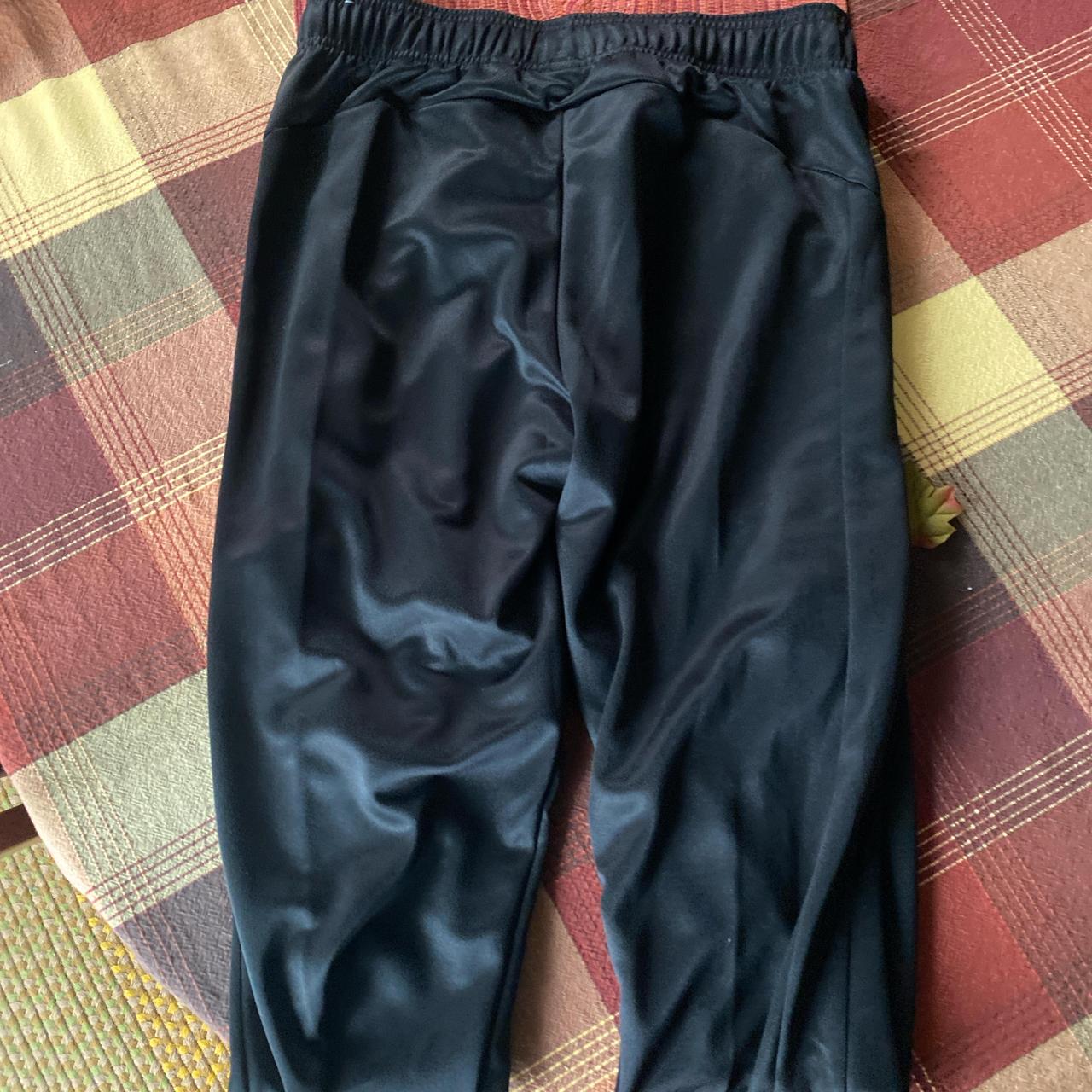 Black Puma joggers with a relaxed fit... - Depop