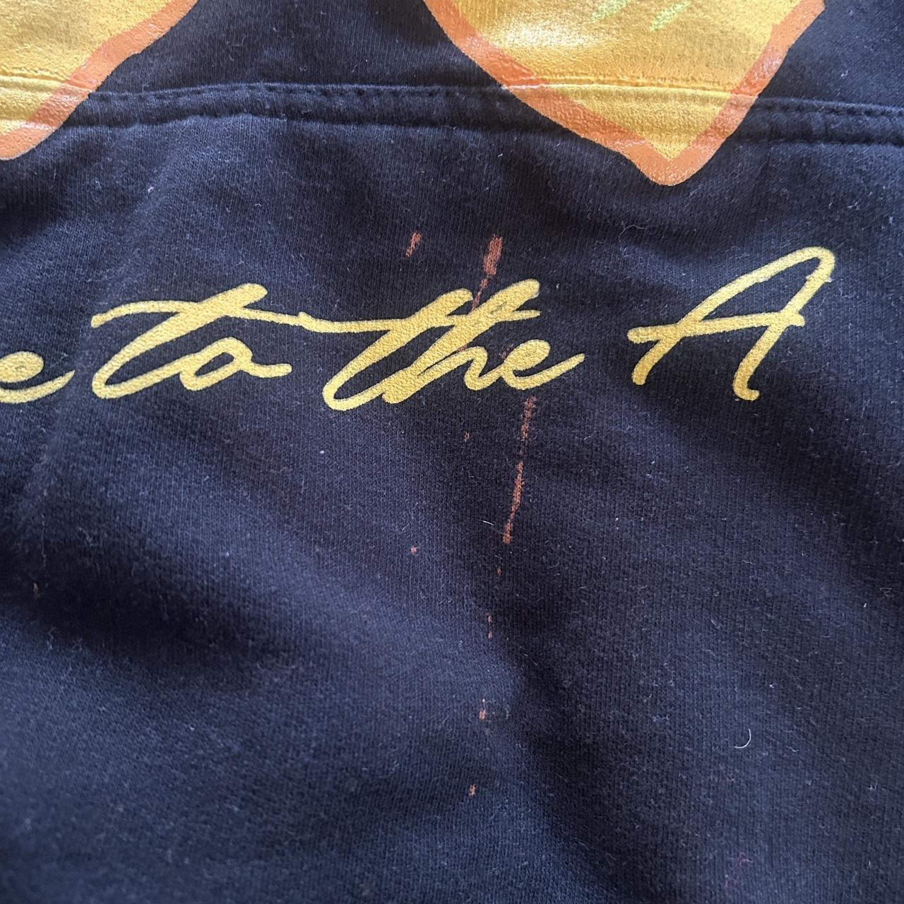 Black and yellow Atlanta hoodie small bleach stain... | Depop