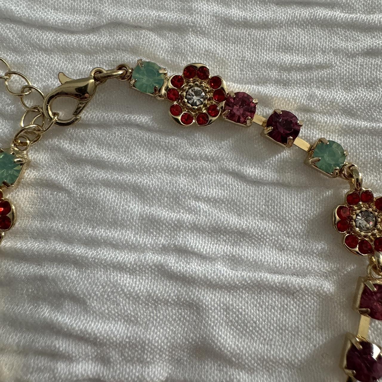 Gold and red flower bracelet #glamour #Bracelet... - Depop