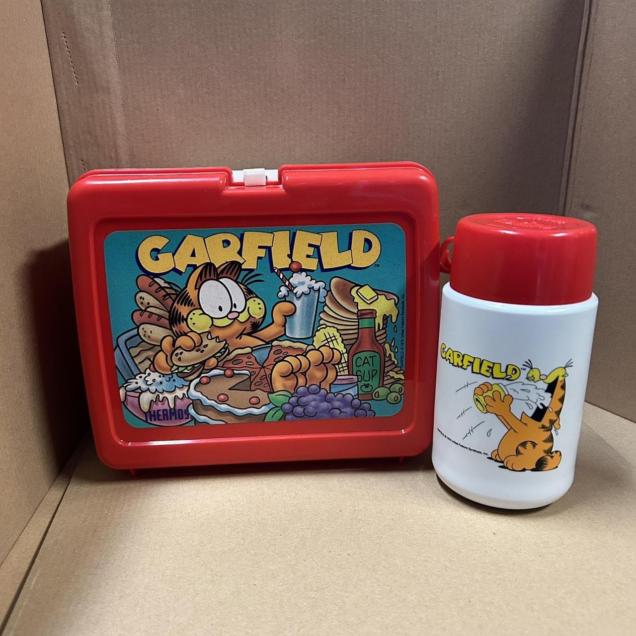 Red and white Garfield lunch box and thermos set... | Depop