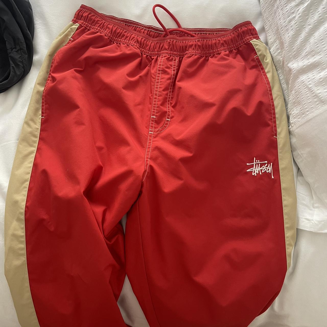 Stussy red tracksuit bottoms Small - Depop