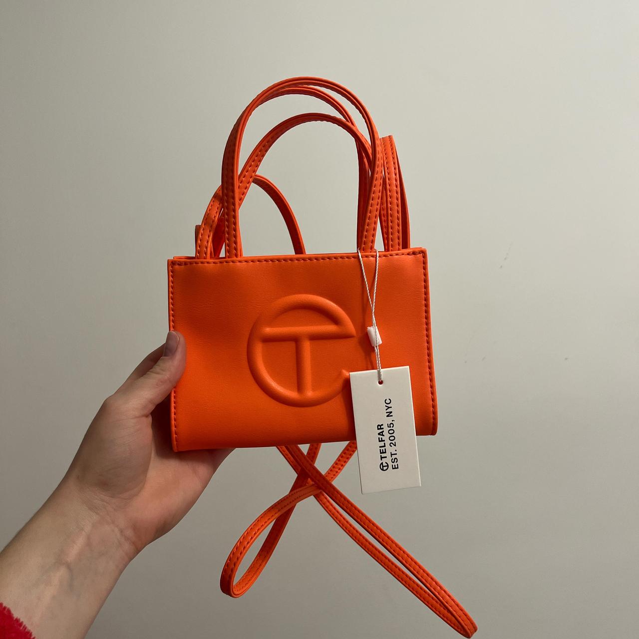 Small orange Telfar bag. Never been worn. Comes with... - Depop