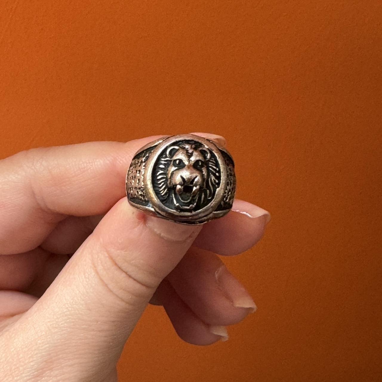 Chunky lion costume jewellery ring. Painted silver... - Depop