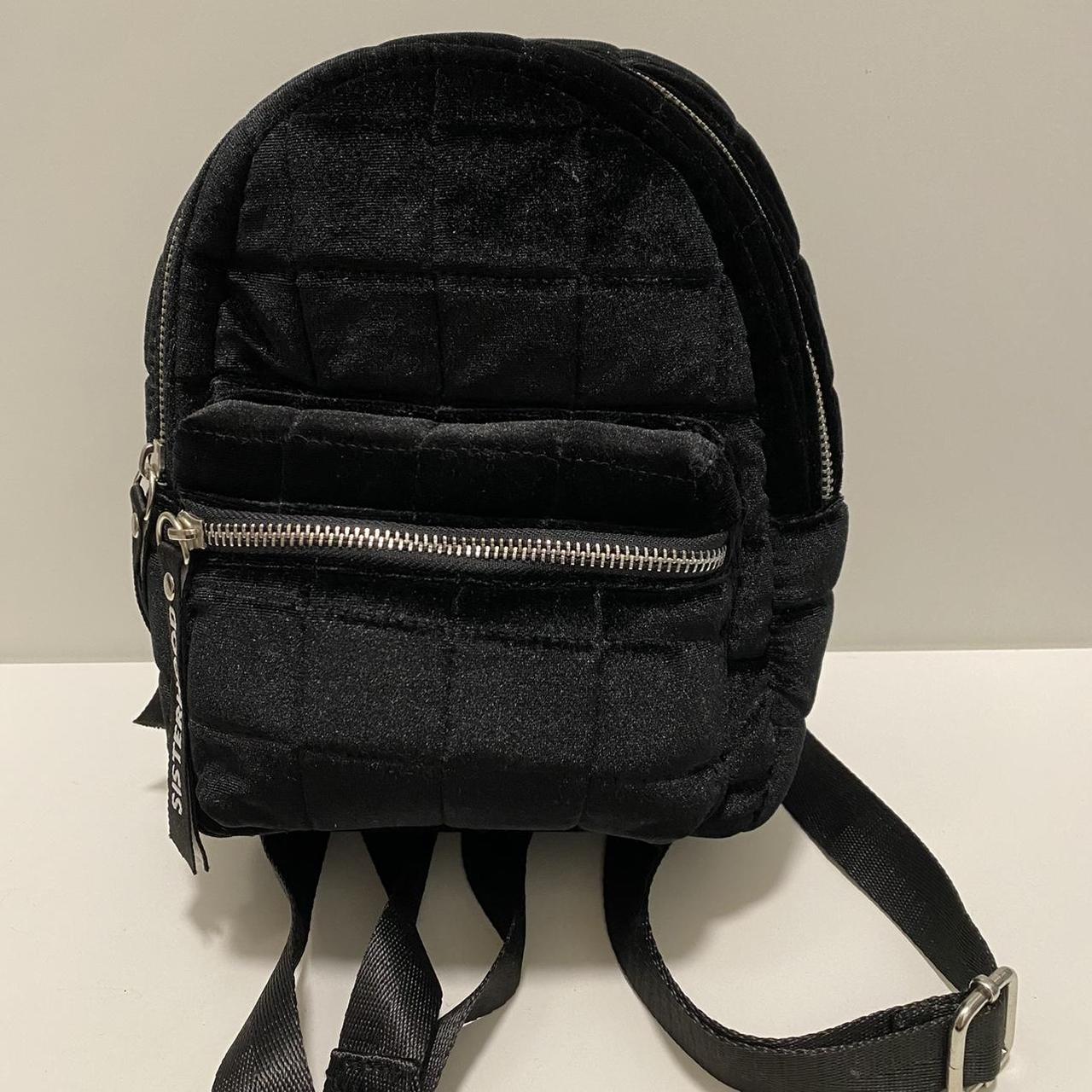 Small black fabric rucksack with small front zip... - Depop