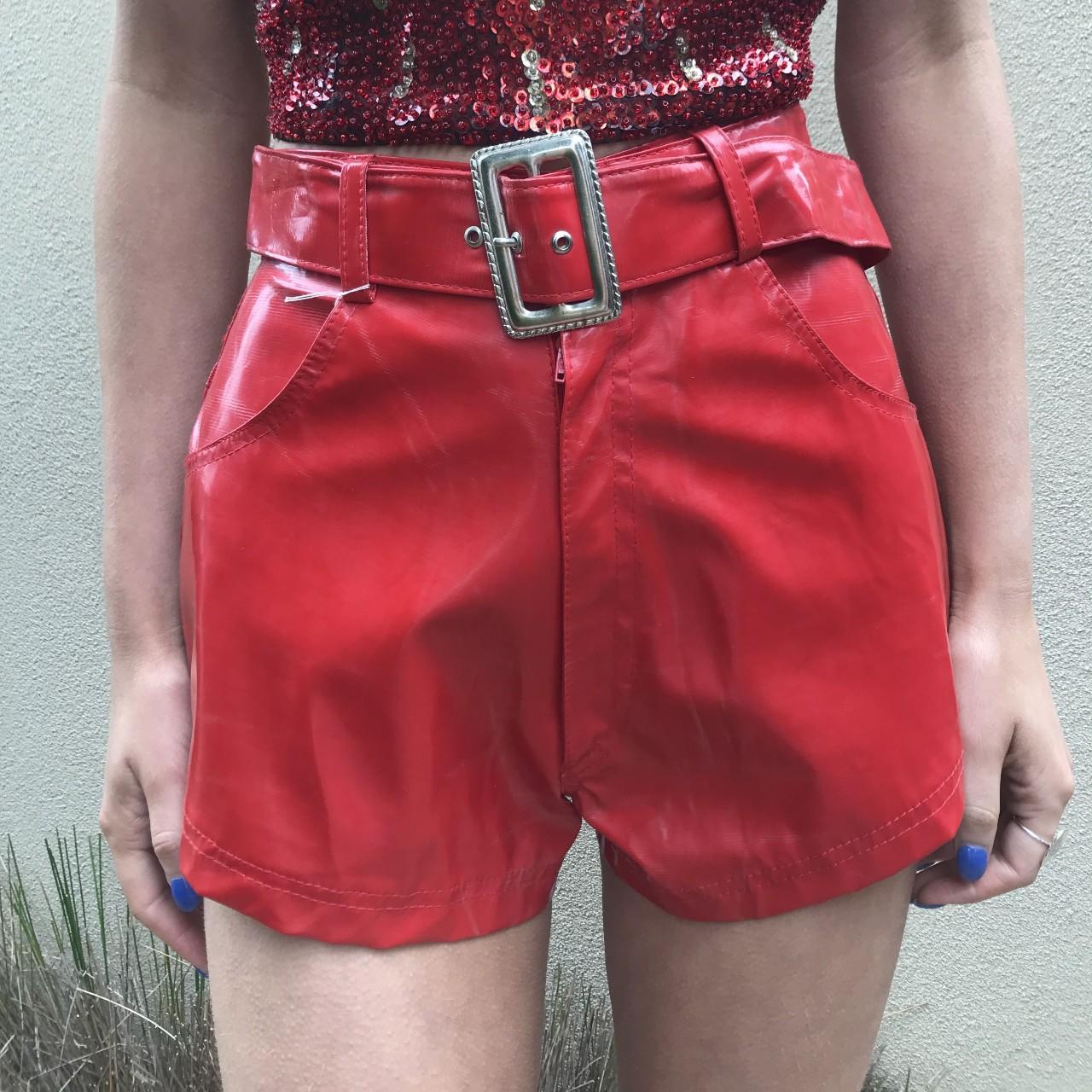 Red faux leather mini shorts with attached... - Depop