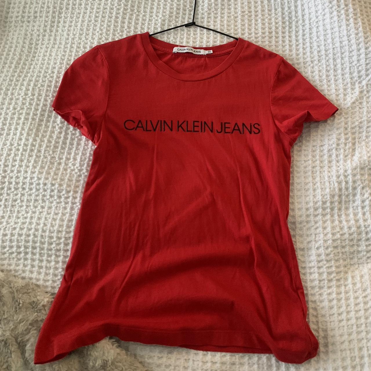 Red Calvin Klein women’s t shirt, great condition. Xs/S - Depop