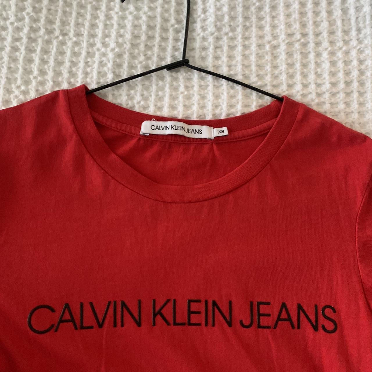 Red Calvin Klein women’s t shirt, great condition. Xs/S - Depop