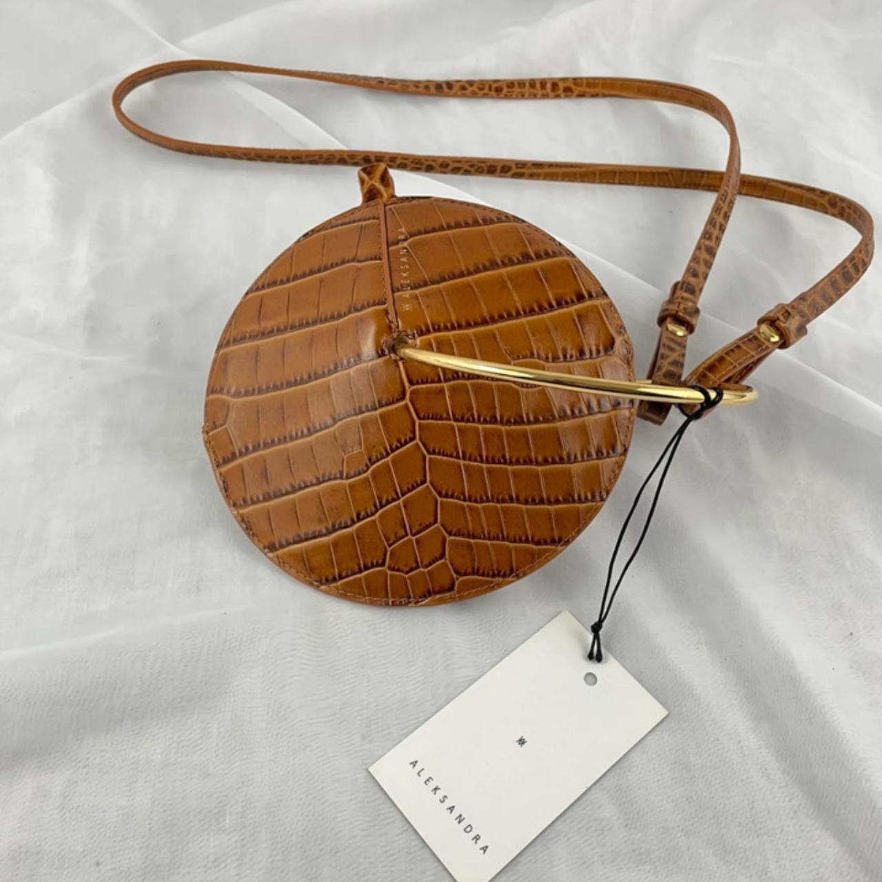 A striking and unique circular handbag by... | Depop