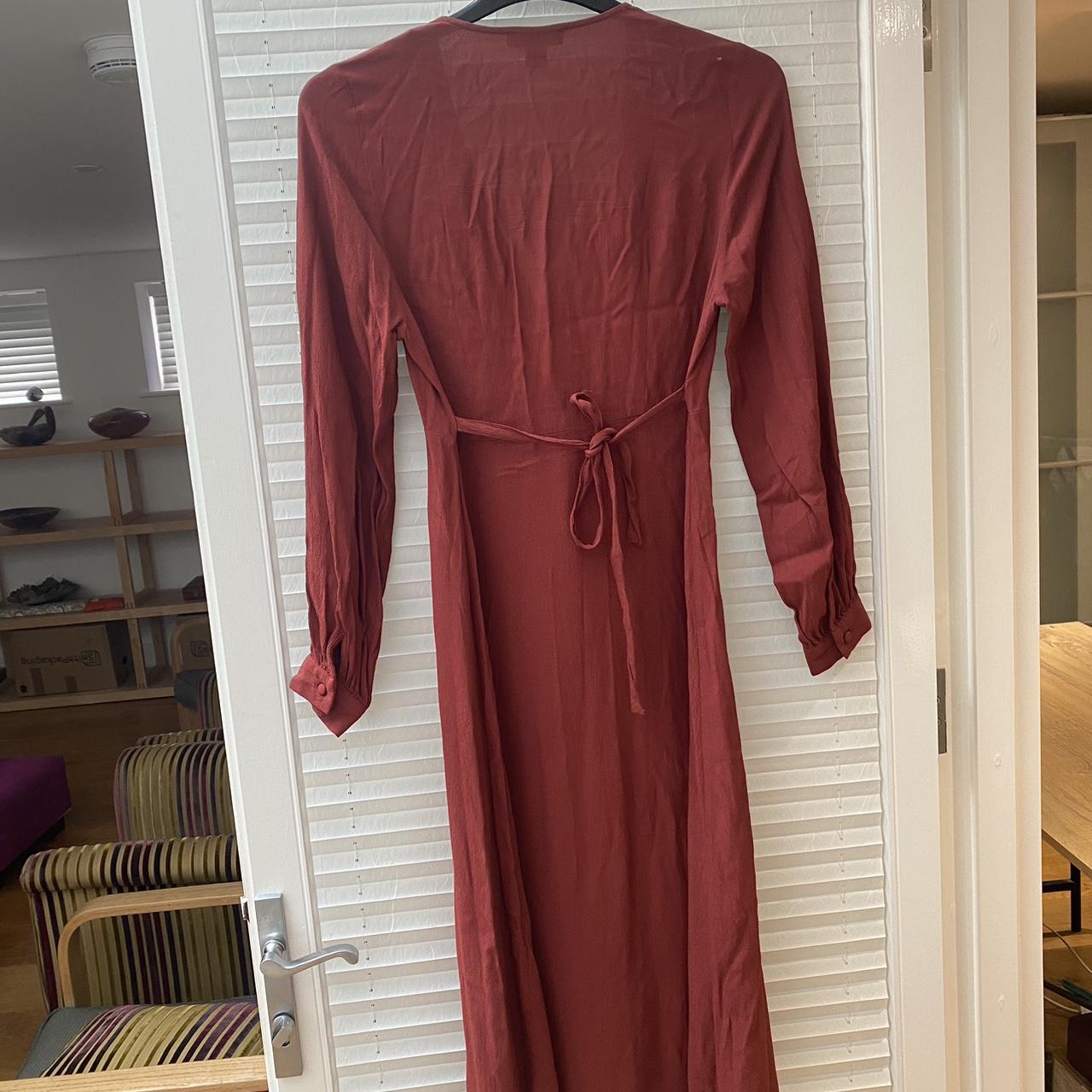 Rust-coloured midi dress with button up detail and a... - Depop