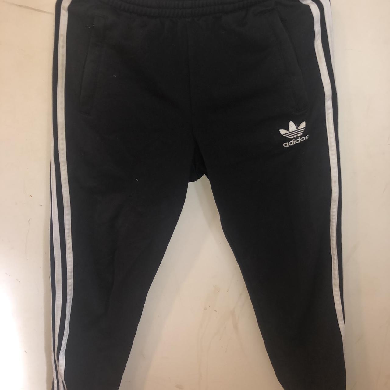 Adidas black tracksuit bottoms with zip up... - Depop