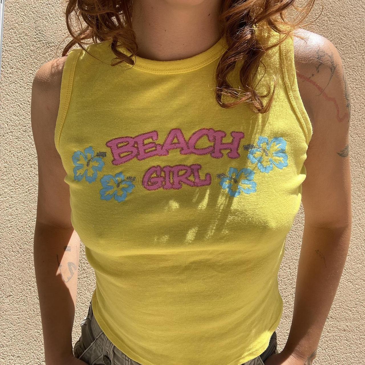 Iconic y2k bright yellow tank top with 'Beach Girl'... - Depop