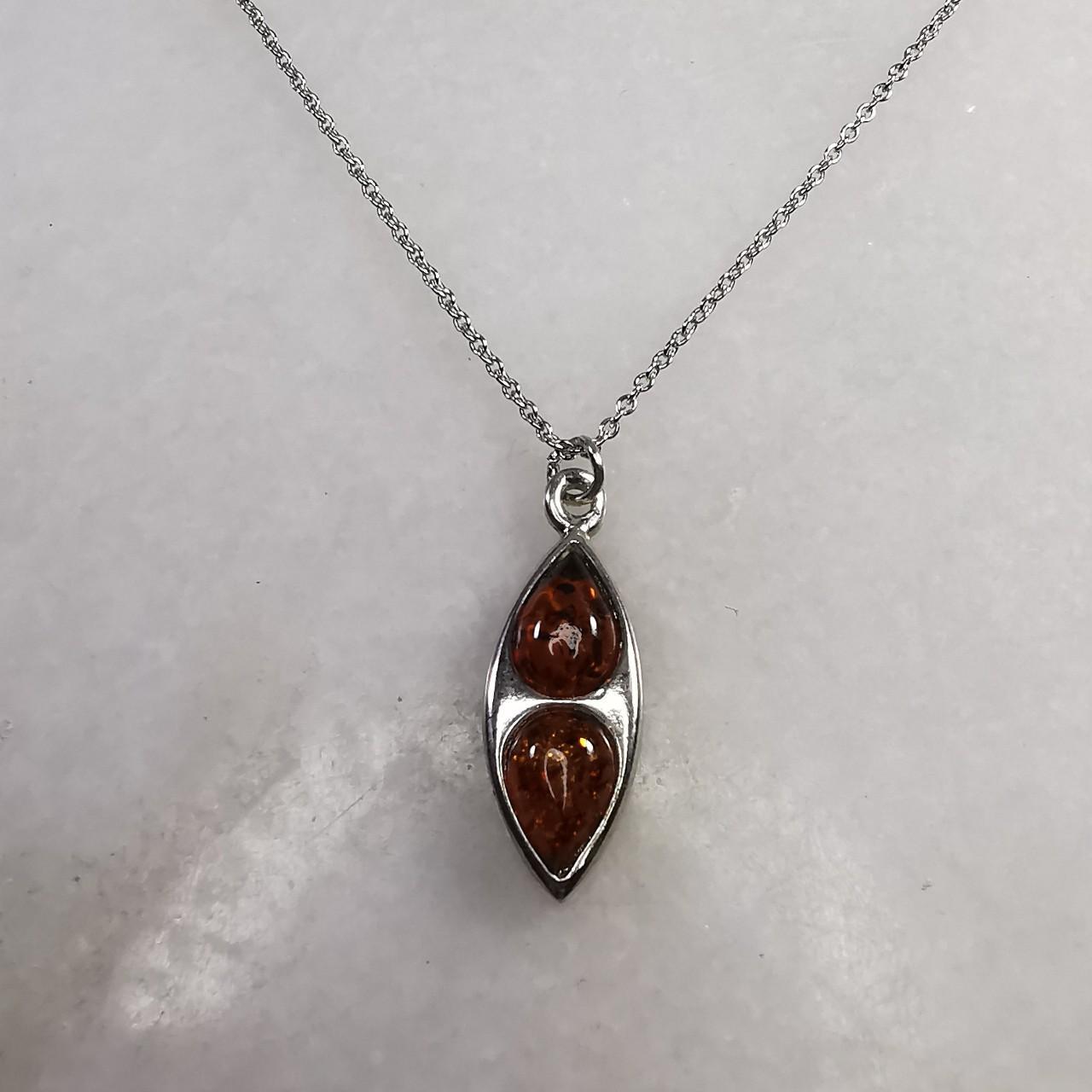 Here we have a sterling silver and amber... | Depop