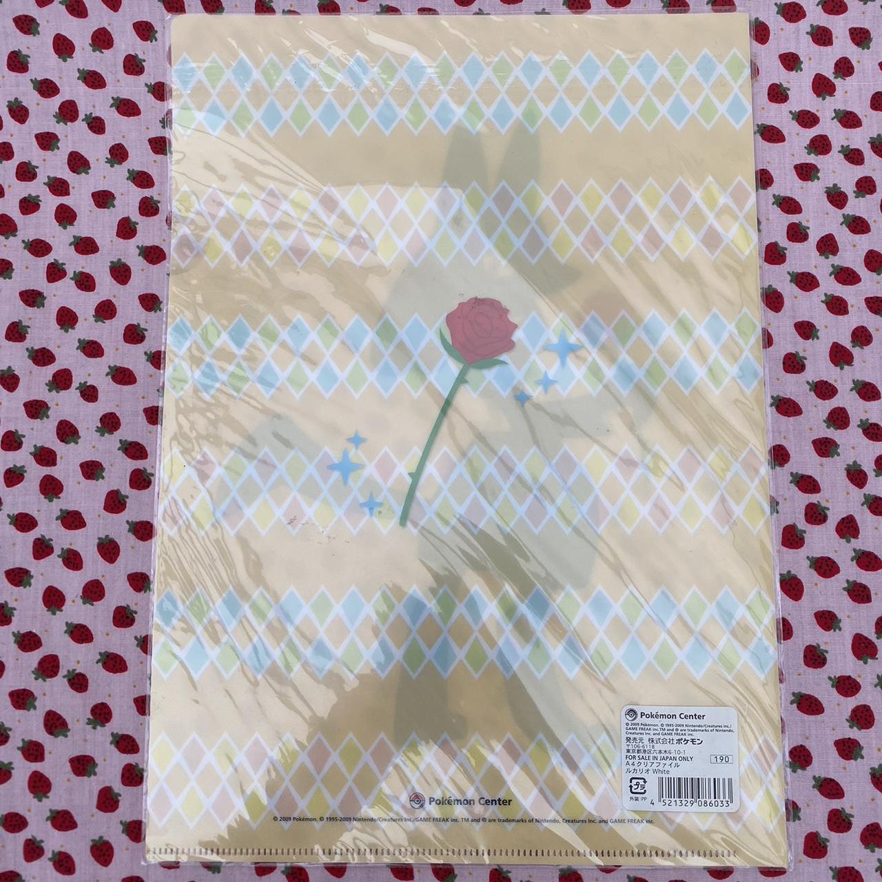 Pokémon file from Pokémon center featuring... - Depop