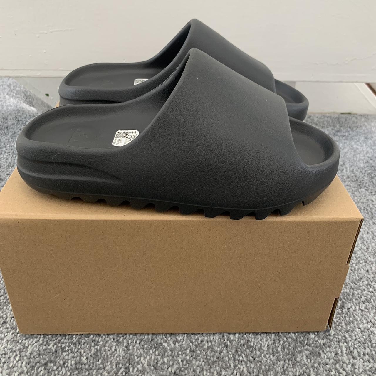 Adidas yeezy slide in black size UK5 dead stock sold... - Depop