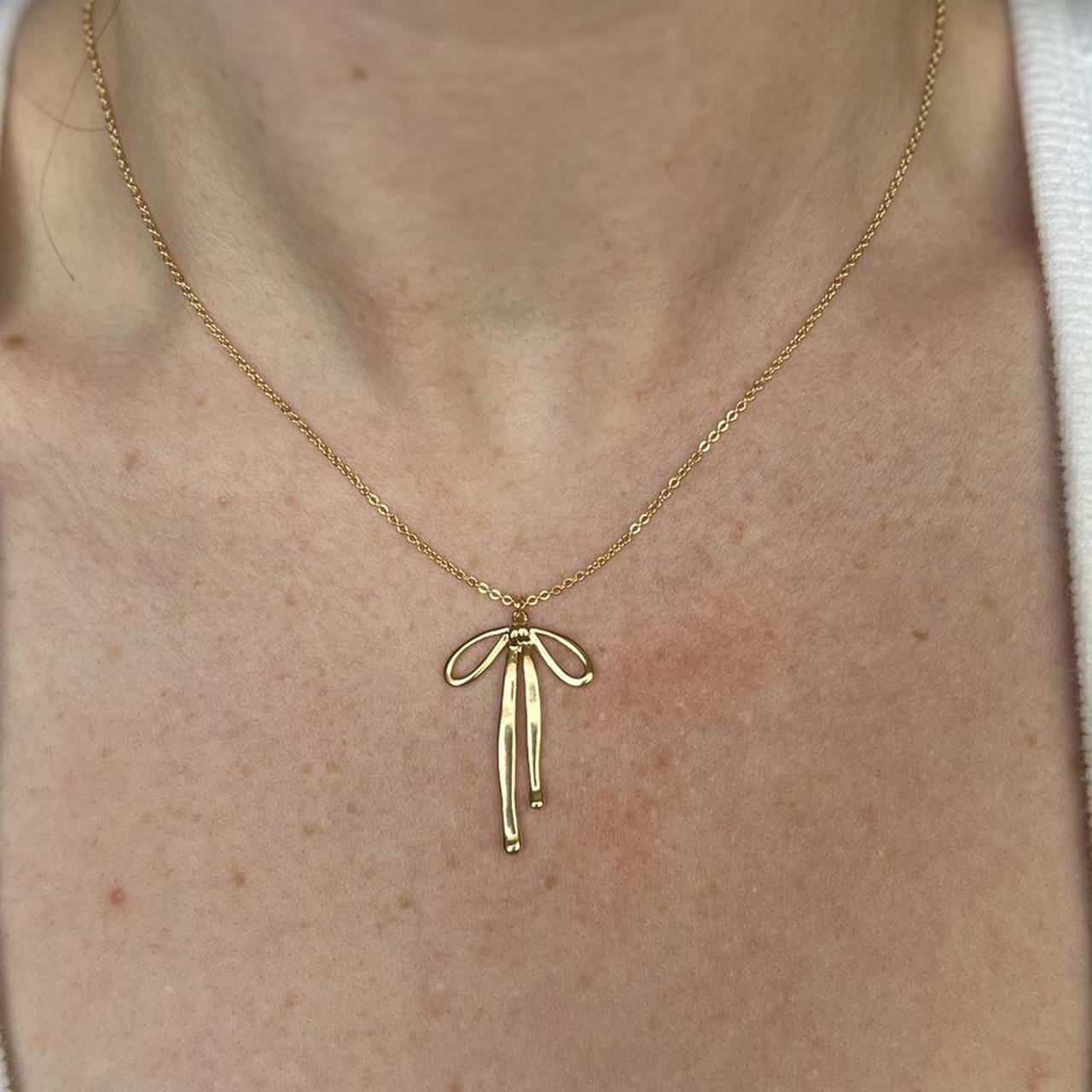 Gold bow charm necklace! 18k plated gold= no... - Depop