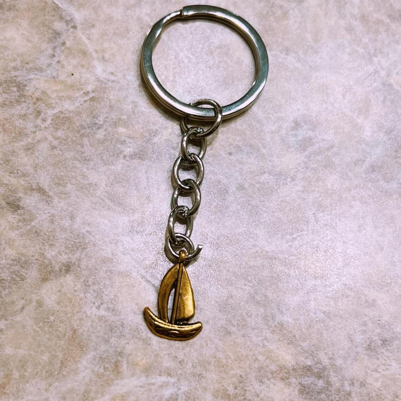 Gold sailboat keychain. Handmade. • • Gold bronze... - Depop