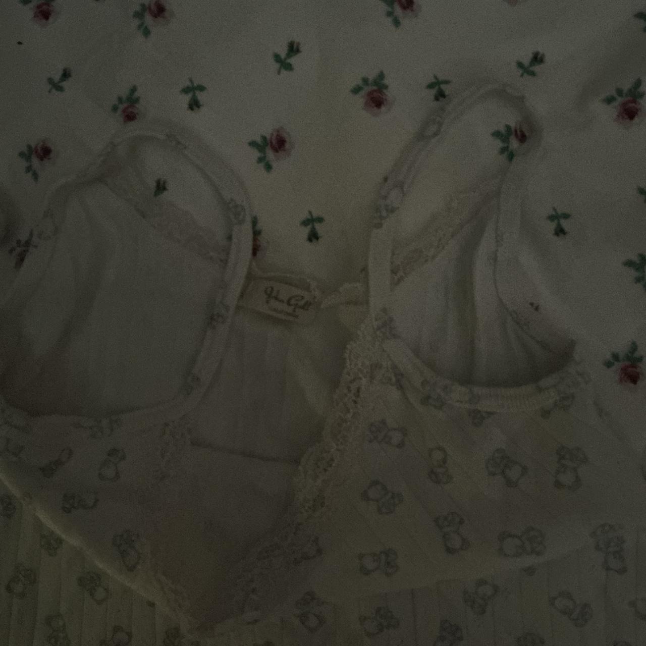 Brandy Melville teddy bear tank with bow worn a... | Depop