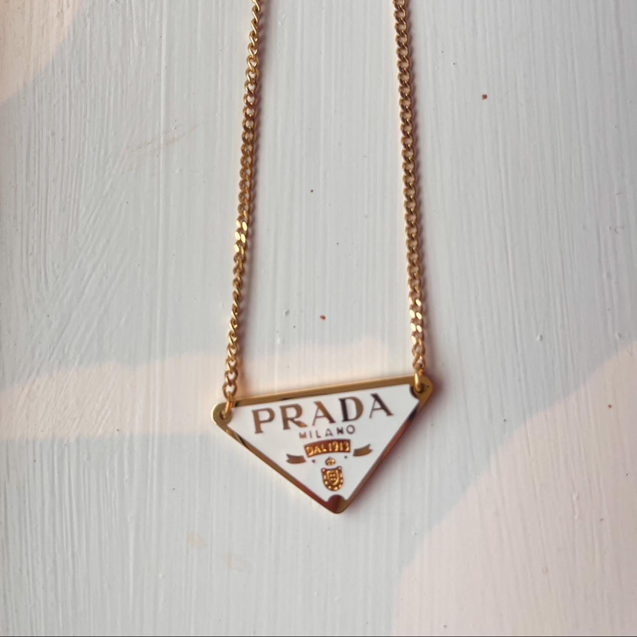 1 REMAINING REWORKED WHITE PRADA GOLD CHAIN... - Depop