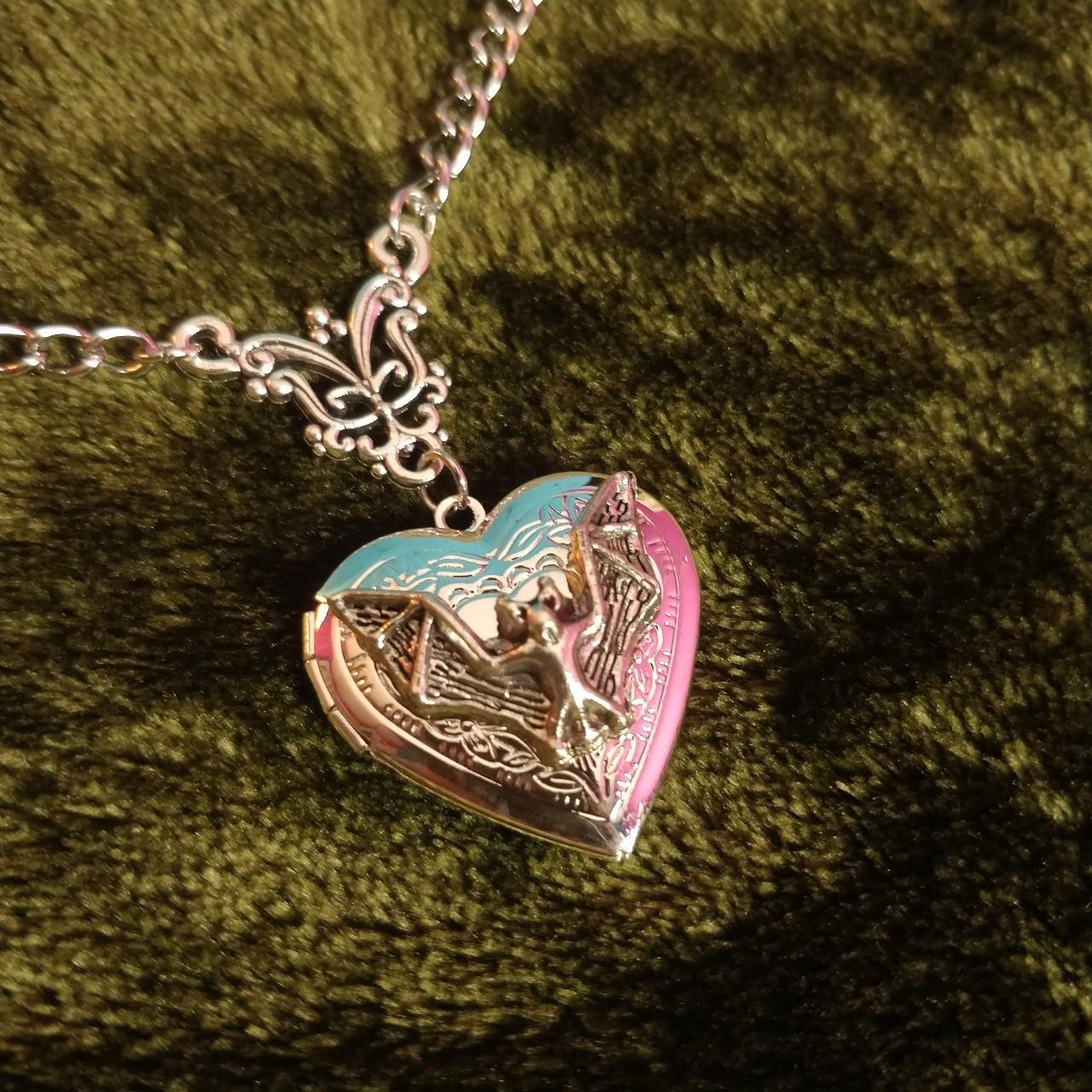 Heart shaped bat locket Locket is openable Chain... - Depop