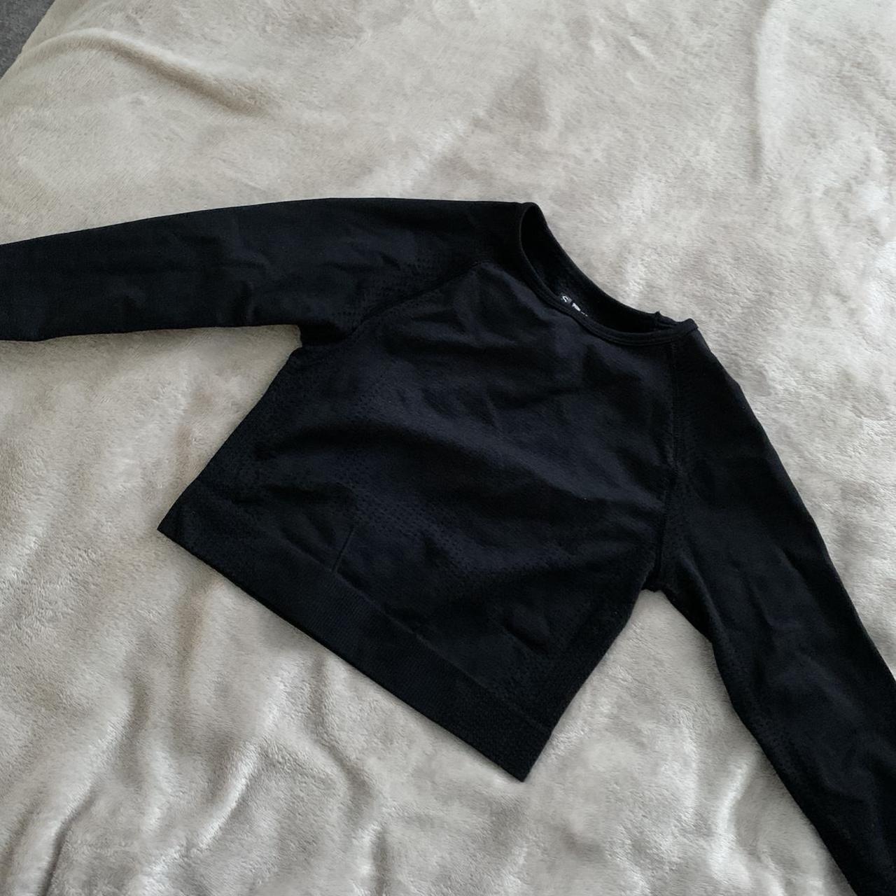 Black long sleeve gym crop top. Size s but fits more... - Depop