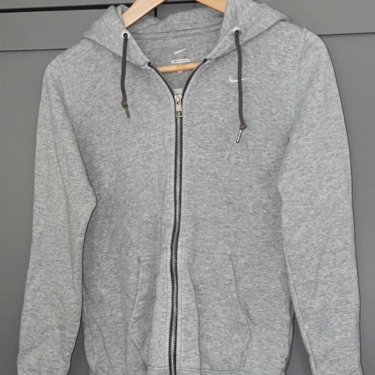 Grey zip up Nike jumper- worn but loads of life... - Depop