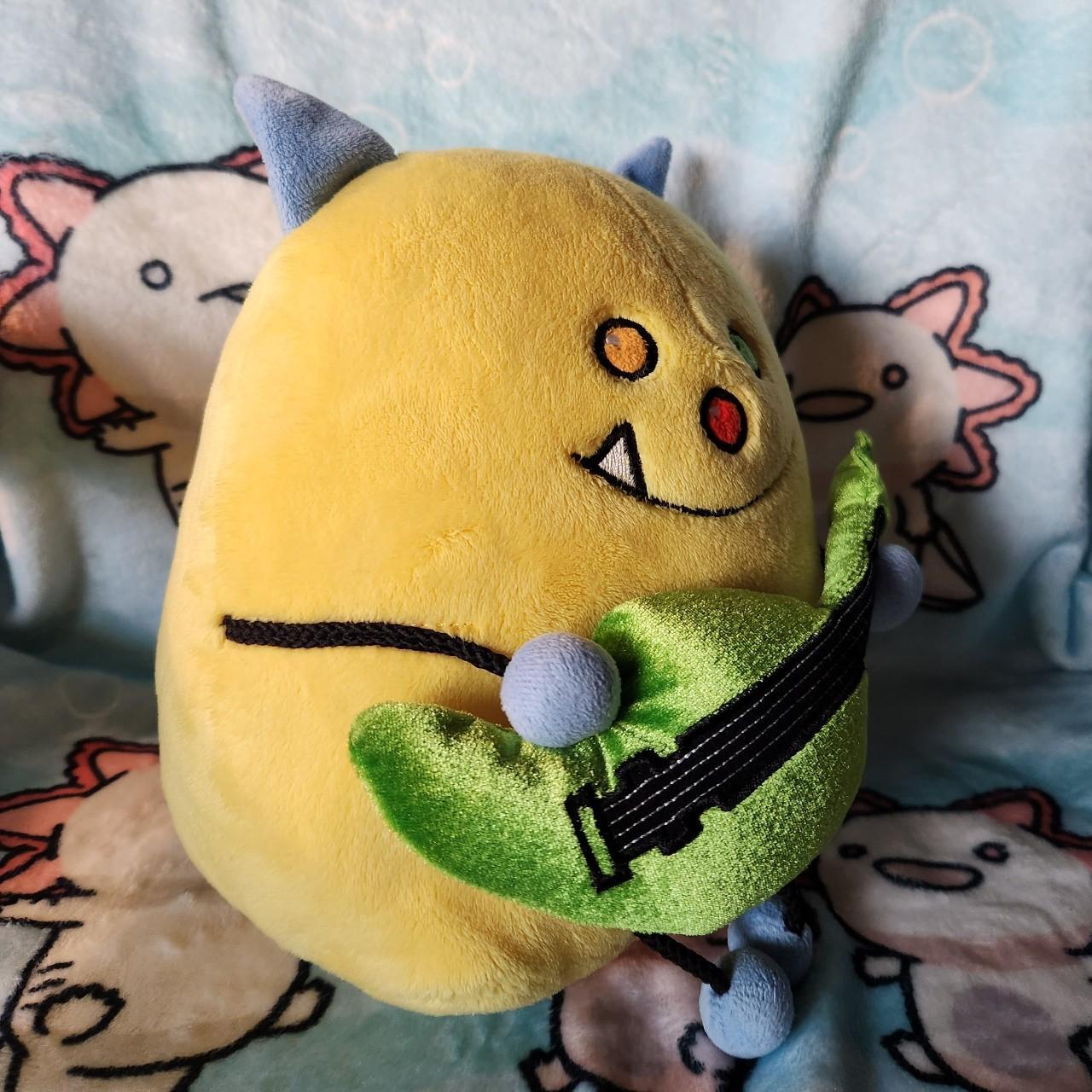 Disney little yellow monster playing a guitar from... - Depop