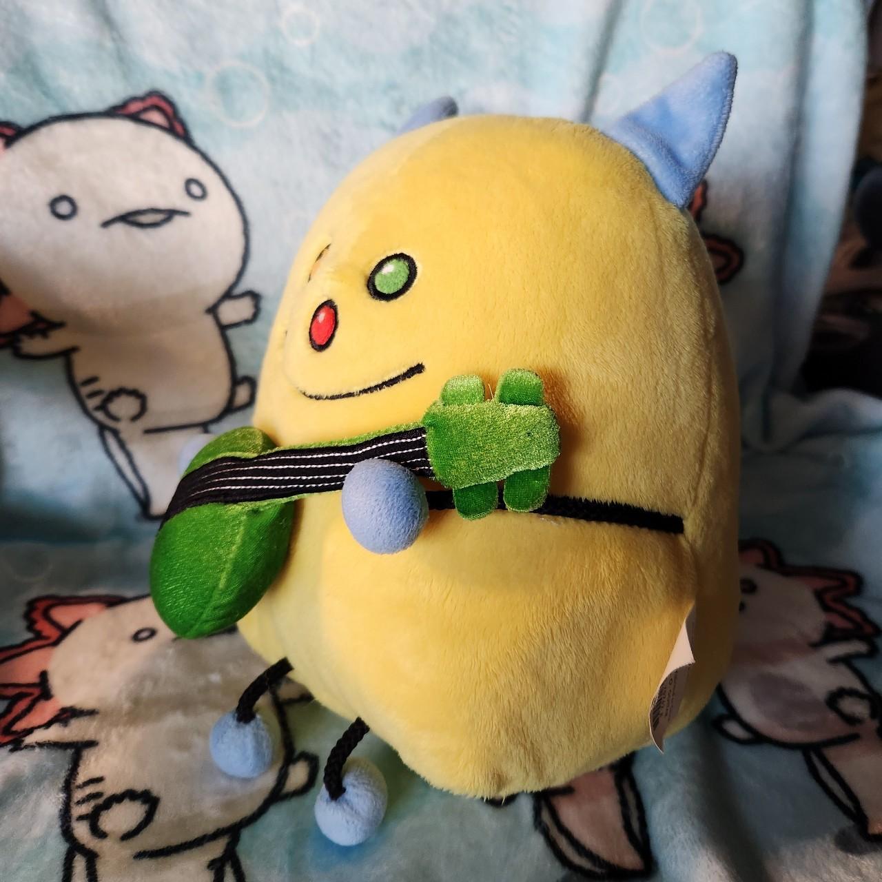 Disney little yellow monster playing a guitar from... - Depop