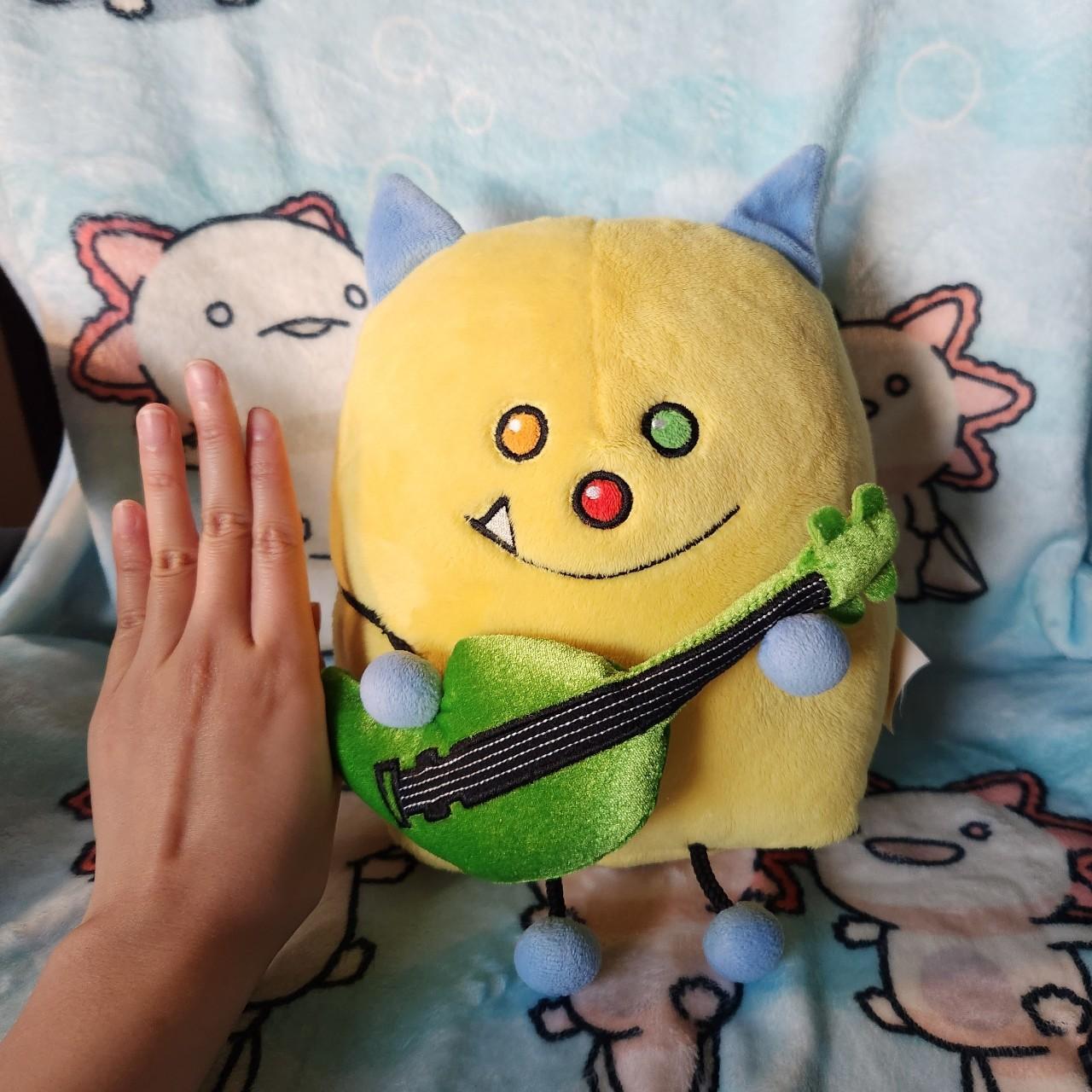 Disney little yellow monster playing a guitar from... - Depop