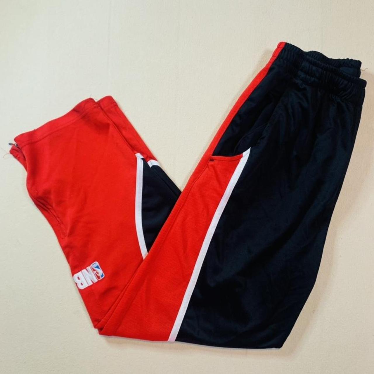 Red and Black NBA zip up sweatpants in good... - Depop