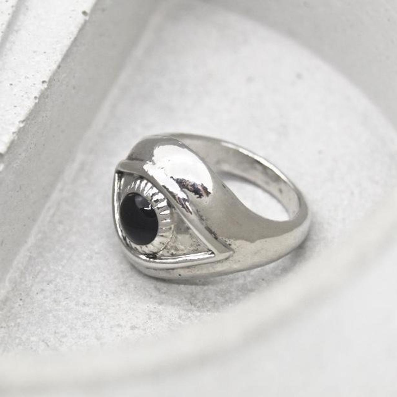 Black Eye Ring A silver eye-shaped ring with a deep... - Depop