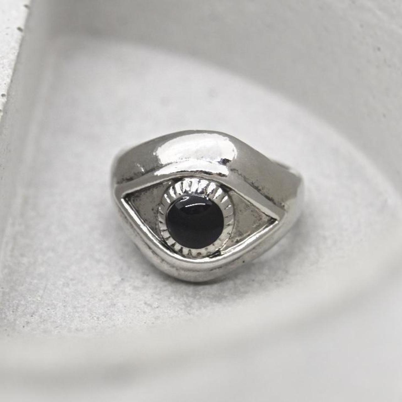 Black Eye Ring A silver eye-shaped ring with a deep... - Depop