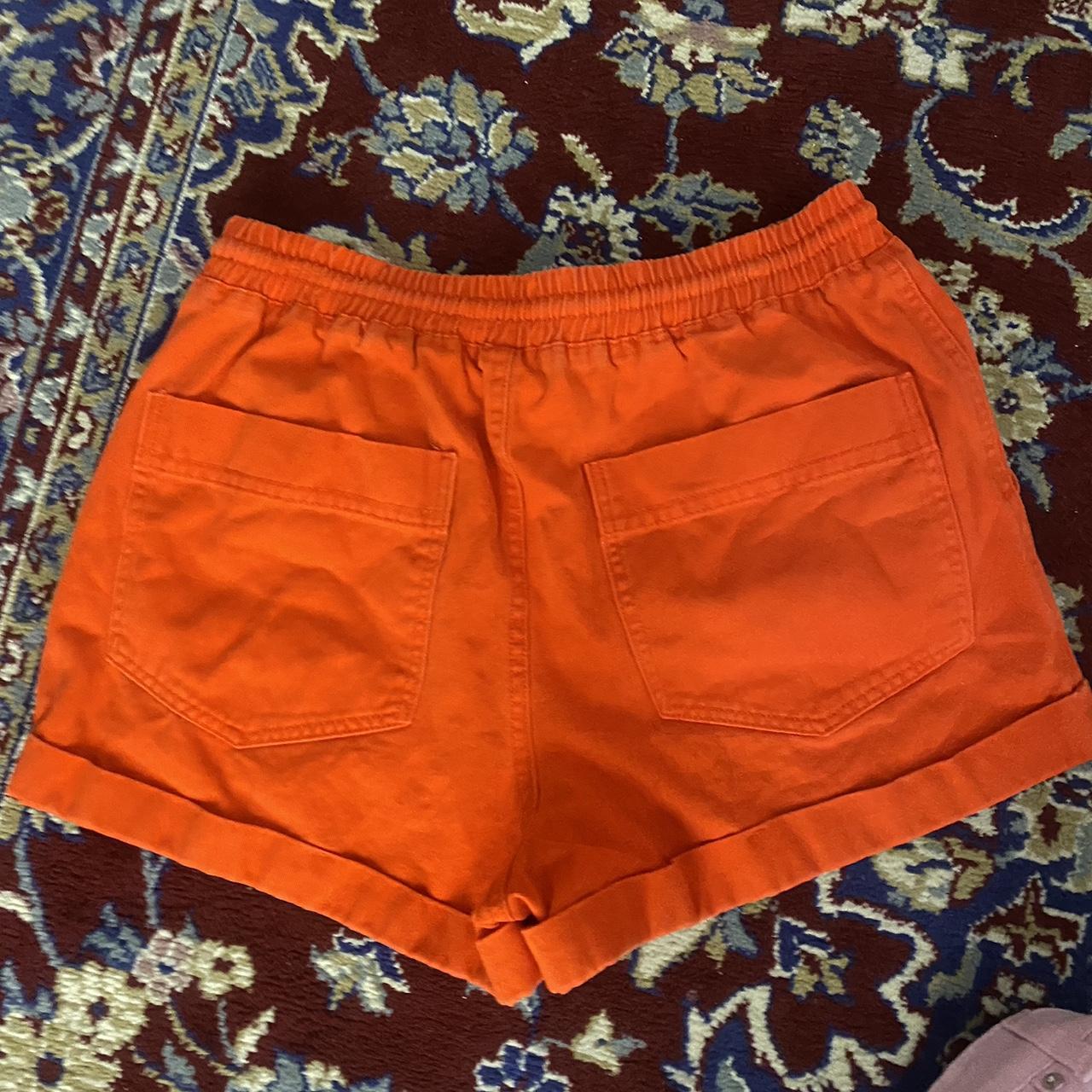 Vibrant orange high waisted shorts. Fits best XS/S... - Depop