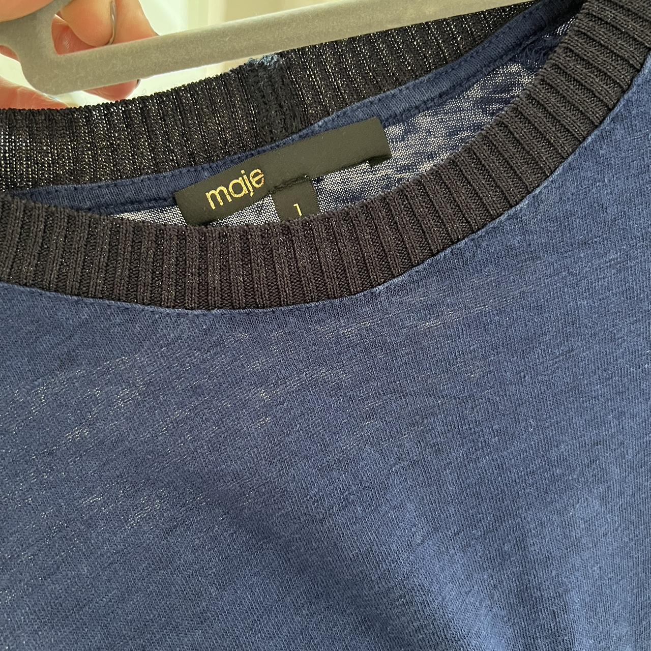 Flattering dark blue with black fabric around neck... - Depop