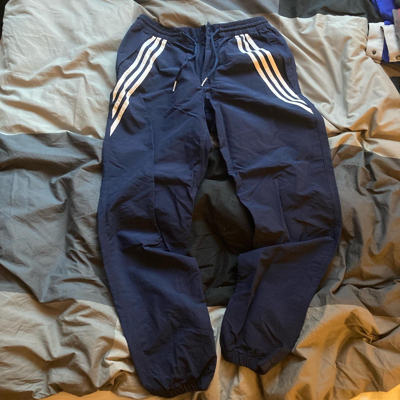 Navy blue adidas trackies with stripes Size... - Depop