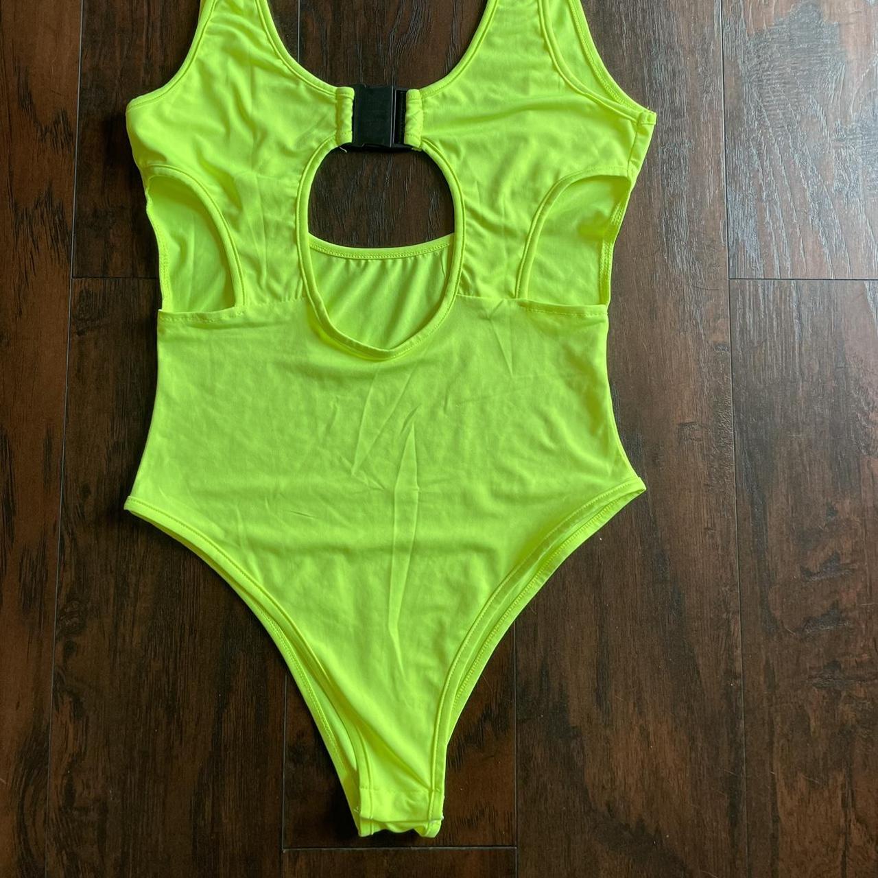 (ON HOLD) Neon cut out body suit never worn . Was... - Depop