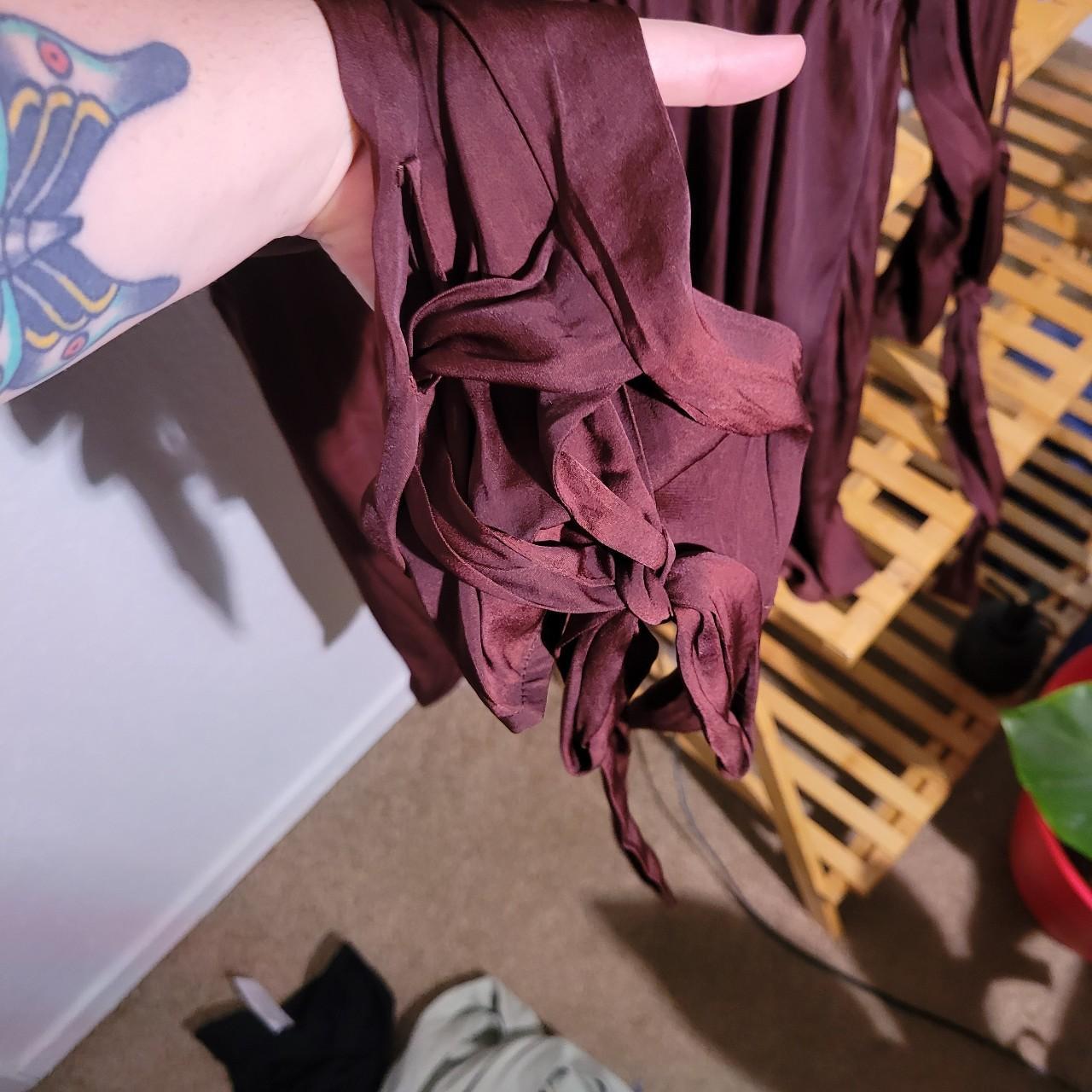 Burgundy vampy high low style top. This a size... - Depop