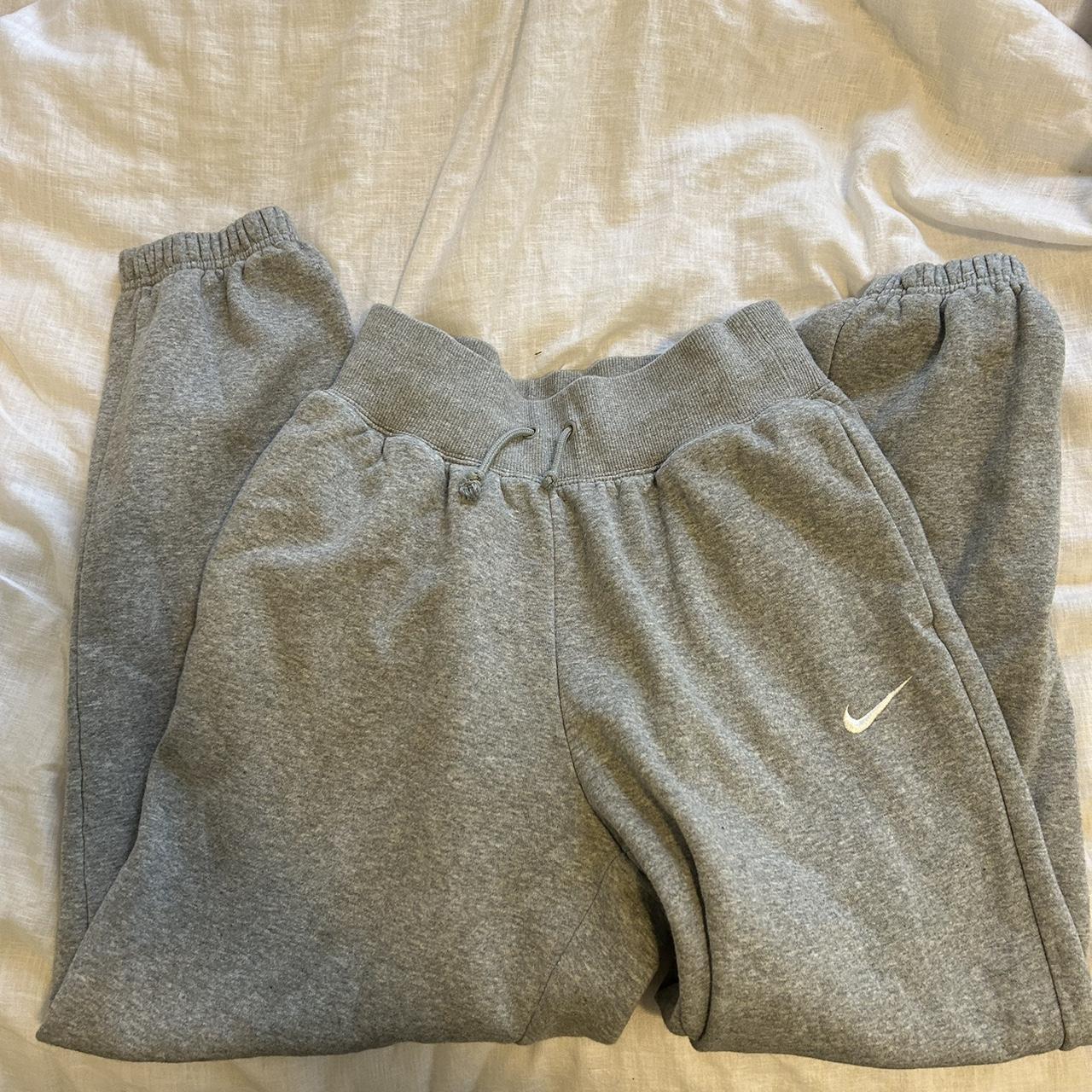 Small grey Nike sweatpants, cinched ankle. Worn a... - Depop