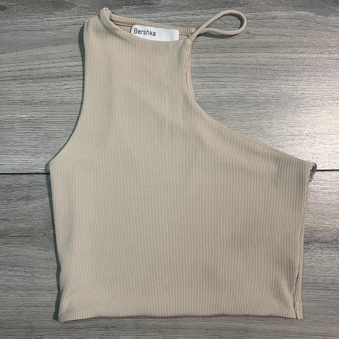 a basic cream crop top with a twist! only worn once - Depop