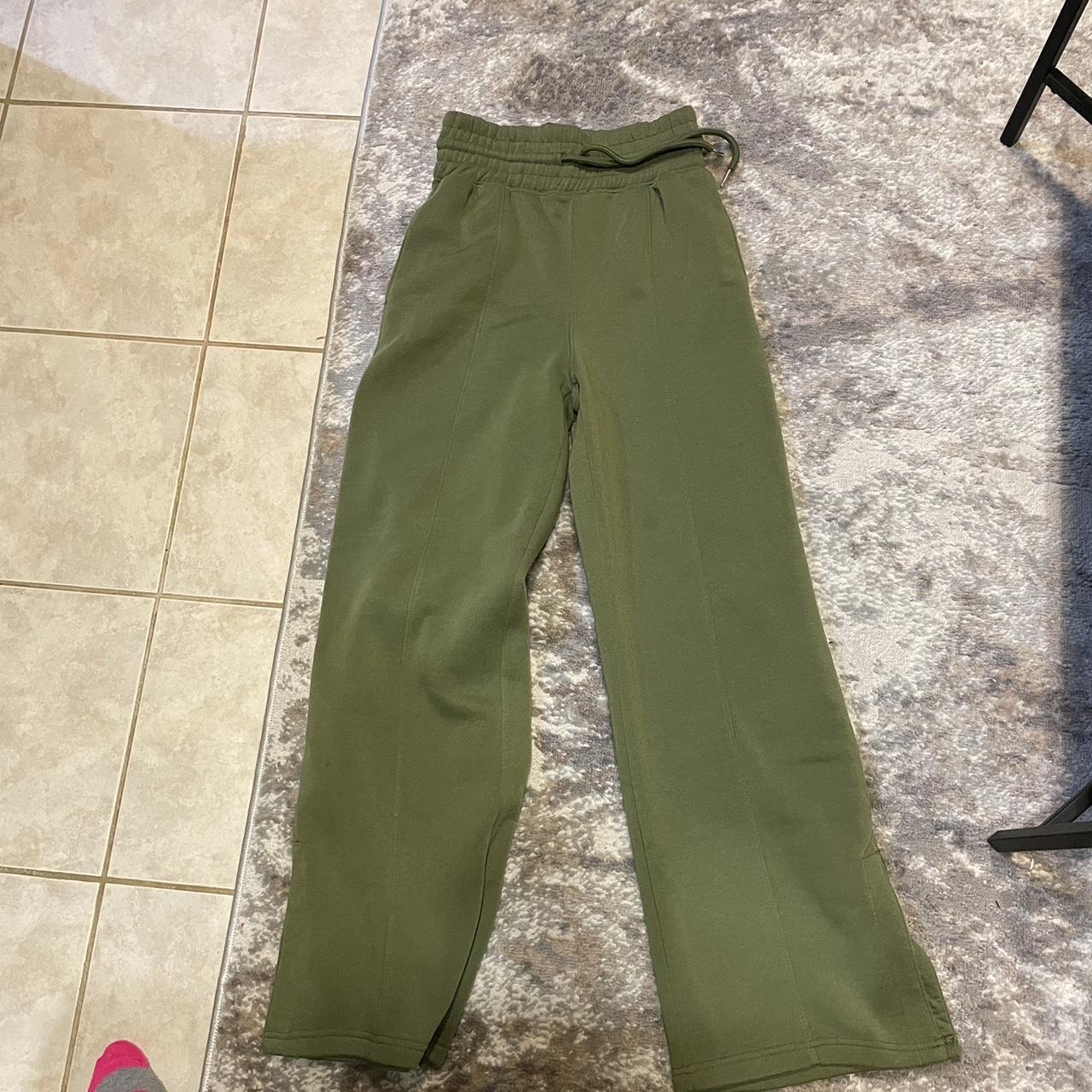 Green sweatpants with slit on bottom - Depop