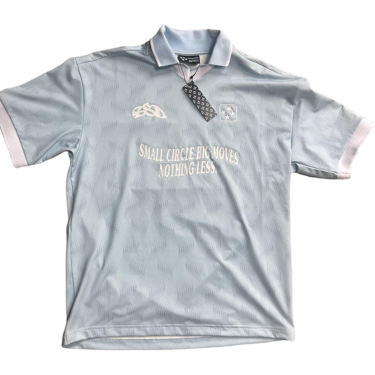 99 based baby blue football top brand new - Depop