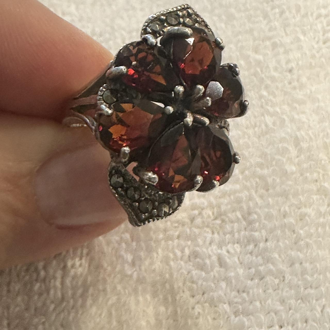 Sterling Silver and red garnet flower ring... - Depop